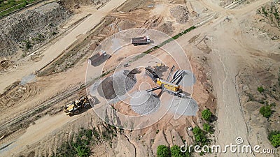 Front End Loader Loading Gravel into Jaw Crusher in Open-pit. Arial ...