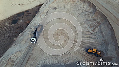 Front End Loader Loading Sand into Dump Truck in Open Pit. Heavy Mining ...