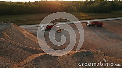 Front Loader Loading Crushed Stone into Dump Truck in Quarry, Aerial ...