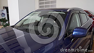 The Front Window of the Blue Car, Black Wipers and Side Mirrors with ...