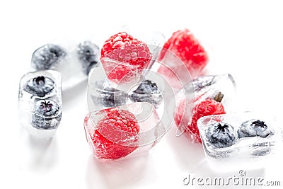 Frozen Blueberry And Raspberry In Ice Cubes On White Background Stock ...