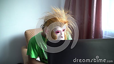 Funny Man in Monkey Mask Works Behind a Computer. Humor Surreal ...