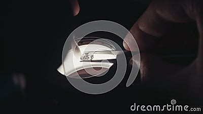 A Gemologist Inspecting a Large Diamond Under a Microscope Stock ...