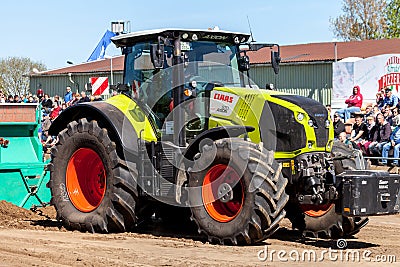 German Claas Axion Tractor Drives On Track By A Traktor Pulling Event ...