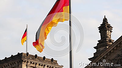 The German Reichstag Building with German Flags in the Wind Stock ...