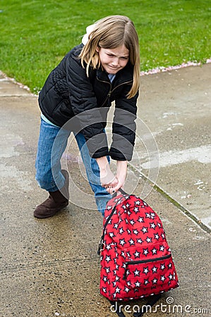 Girl Dragging Heavy Backpack Stock Images - Image: 19661424
