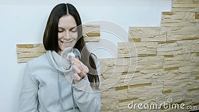 Girl Fiddling with Fidget Spinner while Sitting on the Floor Stock ...