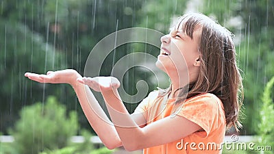 Girl playing in rain stock video. Video of attractive - 73708847