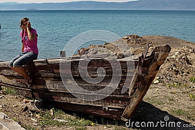 Girl On Shipwrecked Boat Stock Photography | CartoonDealer.com #24616562