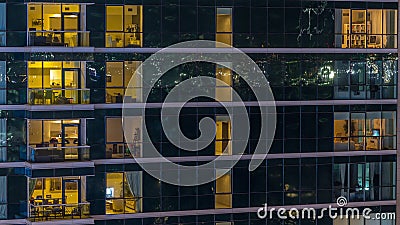 Glowing Apartment Windows at Night in Glass Skyscraper Timelapse Stock ...