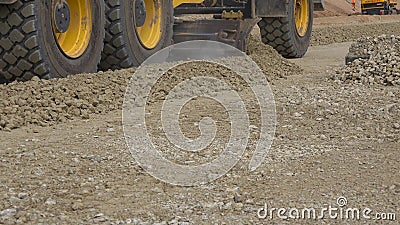 Grader Machine Leveling Rubble Stones on New Road Construction Stock ...