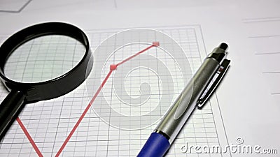 Graph with Calculator and Magnifying Glass Stock Video - Video of ...