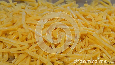 Grated Cheddar Cheese Falling into a Mound Close Up. Stock Video ...
