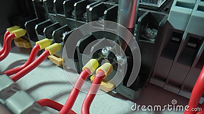 Gray Plastic Electrical Panel with Many Red Wires and Yellow Bushing ...
