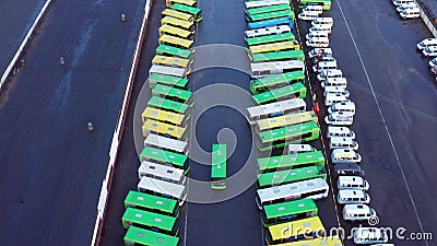 Bus Station with Rows of Yellow, Green, Blue, and White Buses. Stock ...