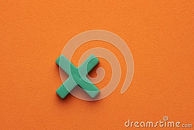 Green Color Math Multiplication Sign On Orange Foamy Background Royalty ...