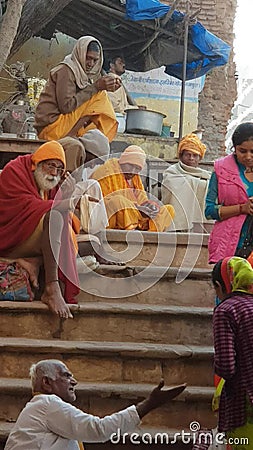A Group of Beggar are Sitting on Stairs in Vicinity of Temple in India ...