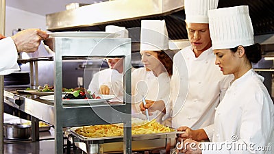 Group of Chefs Giving Plates on Order Line Stock Footage - Video of ...