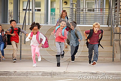 A Group Of Elementary School Kids Rushing Out Of School Royalty-Free ...