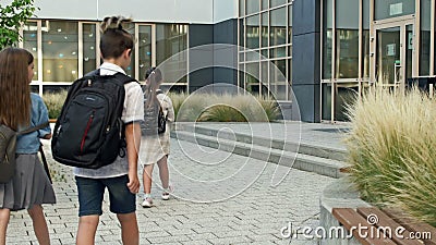 Group of Elementary School Students Rush To a Lesson To School. Back To School Stock Footage ...