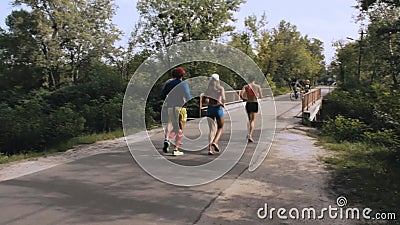 Group of Four People Running in the Park at Sunrise Stock Video - Video ...