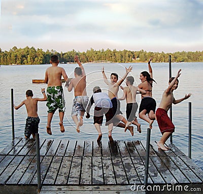 Group Of Kids Jumping Into Lake Royalty Free Stock Image - Image: 6604726