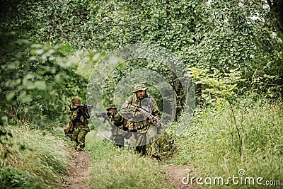 Group Of Soldiers Special Forces During The Raid In The Forest Stock ...