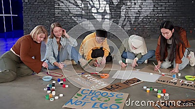 A Group of Young People Draw Posters and Protest Against Environmental ...