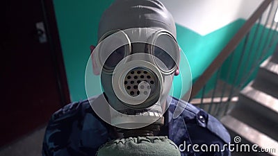 Guard Dressed In Military Uniform In A Gas Mask Looking In The Camera ...