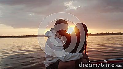 A Guy and a Girl Cuddle Cute at Sunset Sitting in a Boat Stock Footage ...