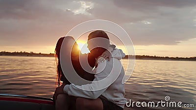 A Guy and a Girl Cuddle Cute at Sunset Sitting in a Boat Stock Footage ...