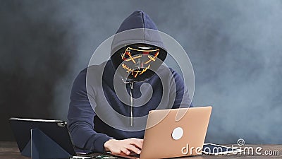 Hacker in a Hood, a Hacker on a Dark Smoky Background. Stock Video ...