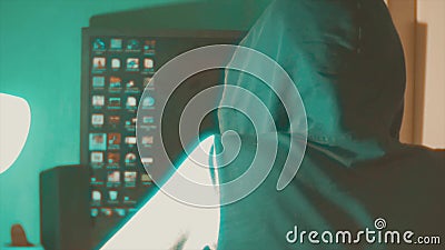 Hacker Man Programmer in the Hood Using Computer for Hack Information and Data from User Account ...