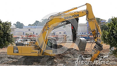 Excavator and Excavator Hammer Working on the Demolition of a Building ...
