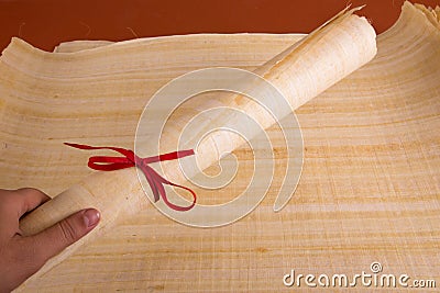 Hand hold message on Egyptian papyrus - Stock Image - Everypixel