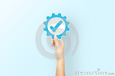 Hand Holding Paper With Icon Gear And Check Mark On Light Blue ...