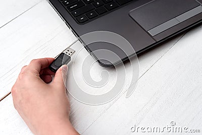 Hand Inserting USB Flash Drive Into Laptop Computer On White Background ...