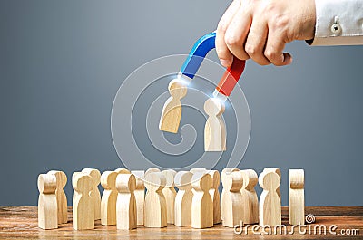 A Hand With A Magnet Pulls Green People Out Of Crowd. Recruiting New ...