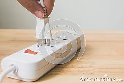 Hand Of Male Or Female Unplugged Plug Into Socket To Save Energy ...