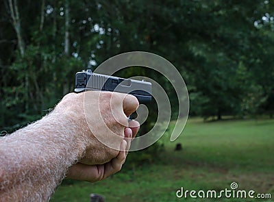 Handgun Being Aimed At Target. Firearm For Personal Protection. Royalty ...