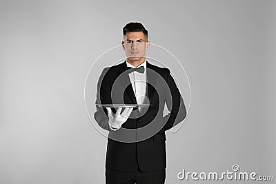Handsome Butler With Tray On Light Grey Background Royalty-Free Stock ...