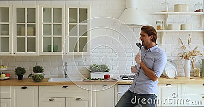 Handsome Happy Man Singing and Dancing Alone in Modern Kitchen Stock ...