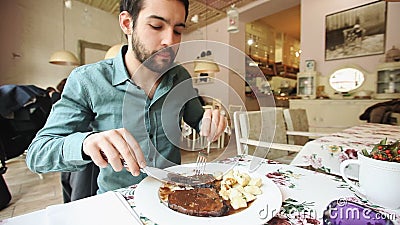 Handsome Young Man Eating in a Restaurant Stock Footage - Video of ...