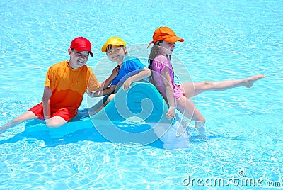 Children on float in pool stock photo. Image of cool - 12021456