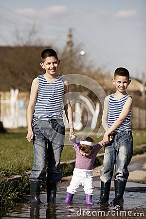 Happy Children Playing In The Puddle Stock Photography | CartoonDealer ...