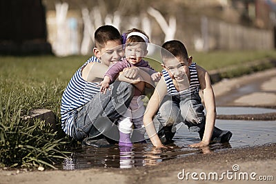 Happy Children Playing In The Puddle Royalty-Free Stock Photography ...