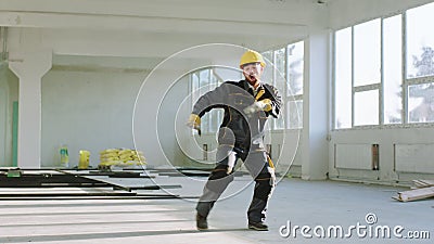 Happy and Excited Construction Worker at Construction Site Dancing and ...