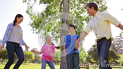 Happy Family Dancing Together on the Grass Stock Video - Video of ...