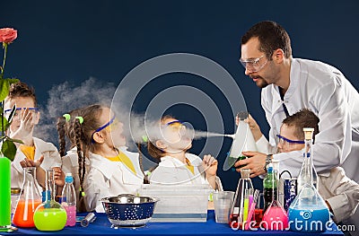 Happy Kids With Scientist Doing Science Experiments In The Laboratory ...