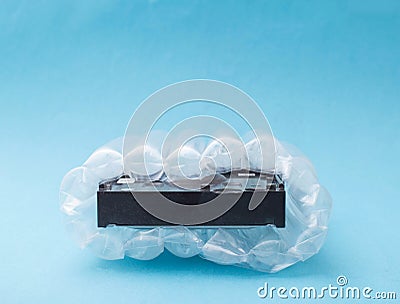 Hard Disk From A Computer In A Shock-resistant Package On A Blue ...